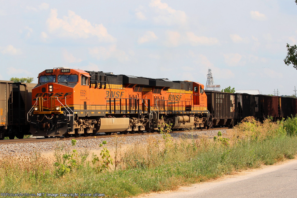 BNSF 6891 heads nb with a coal train.